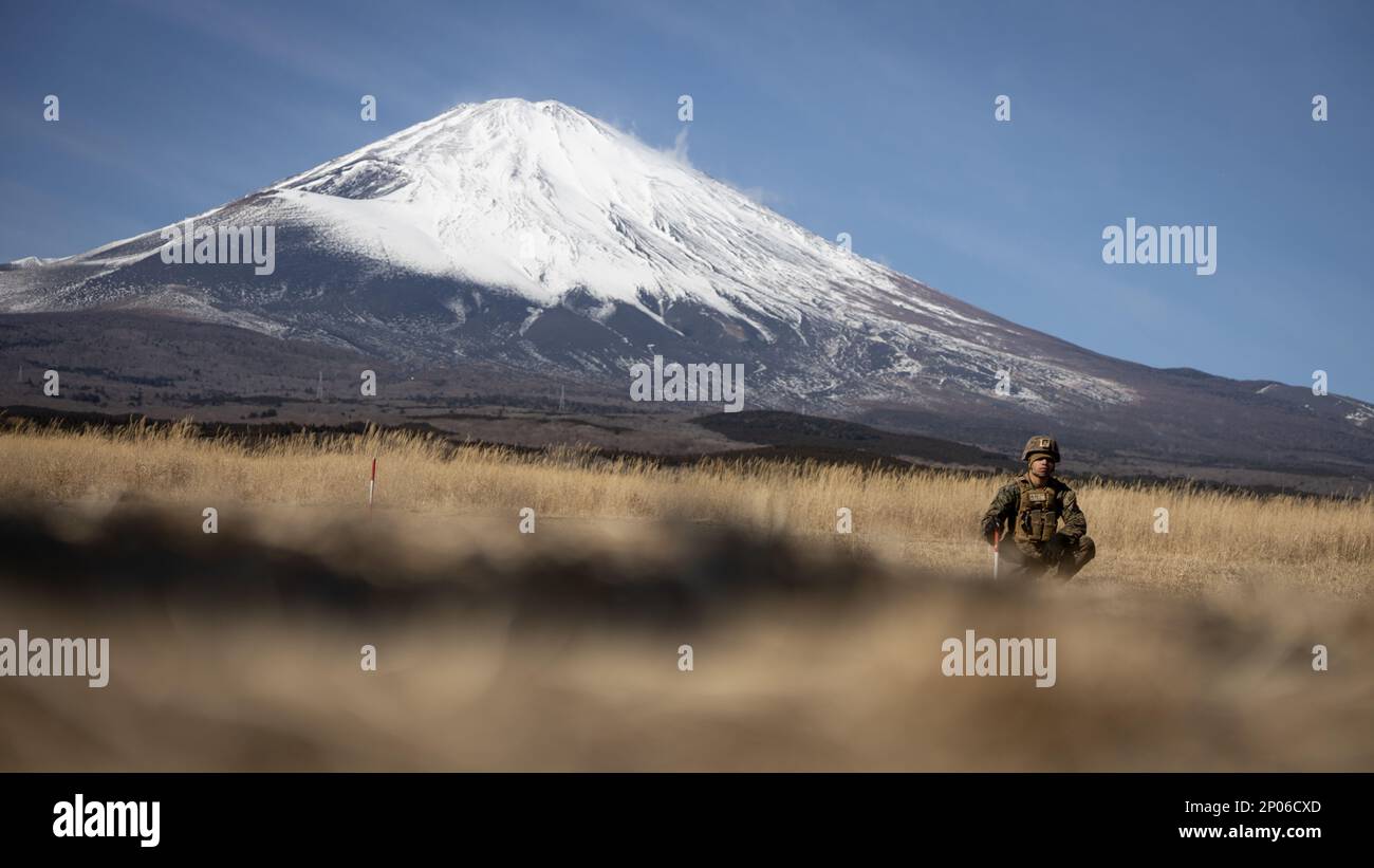 A U.S. Marine with 3d Battalion, 4th Marines places aiming stakes for ...