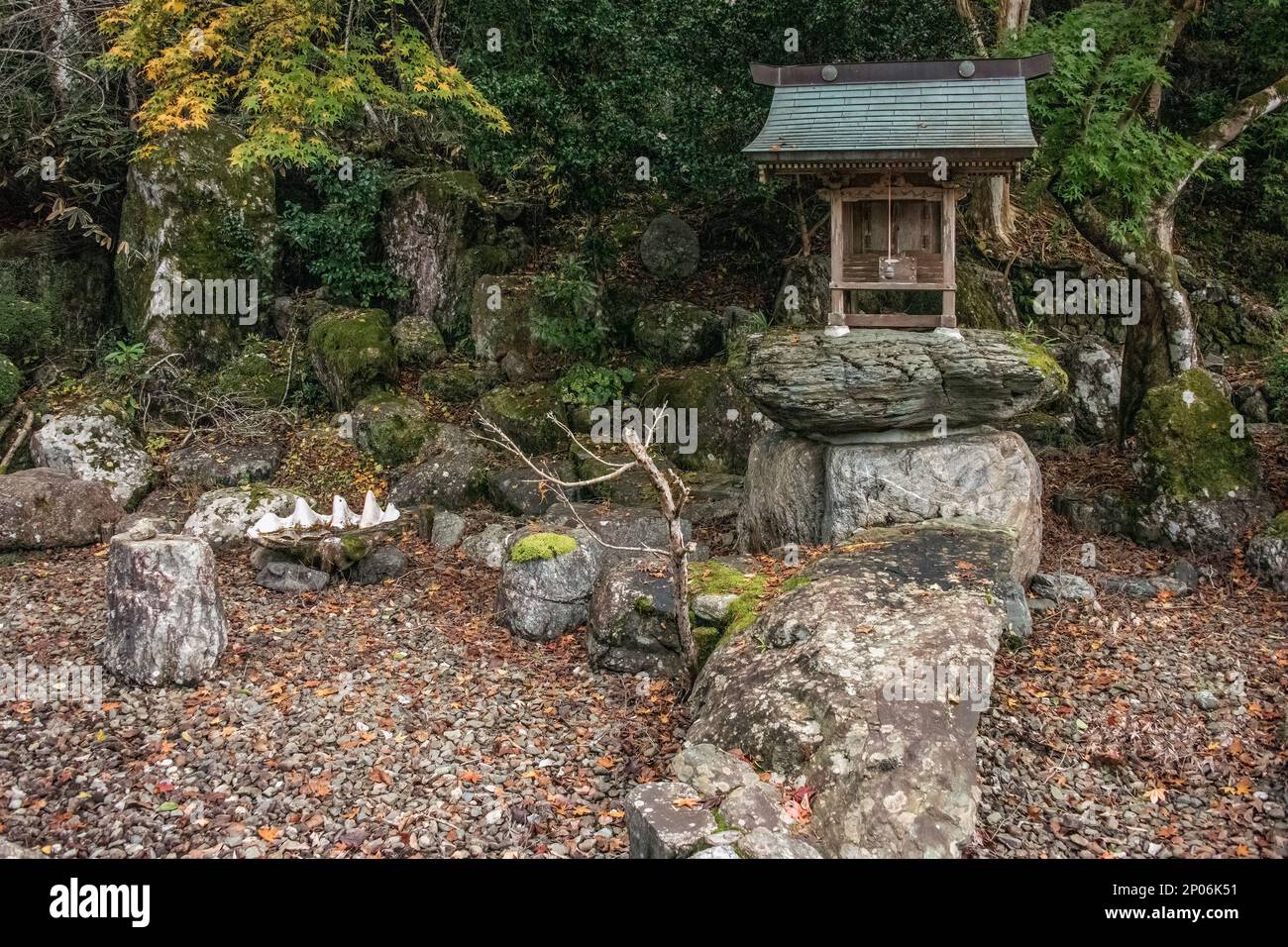 Small temple in the garden of Jinguji Buddhist temple with fallen ...