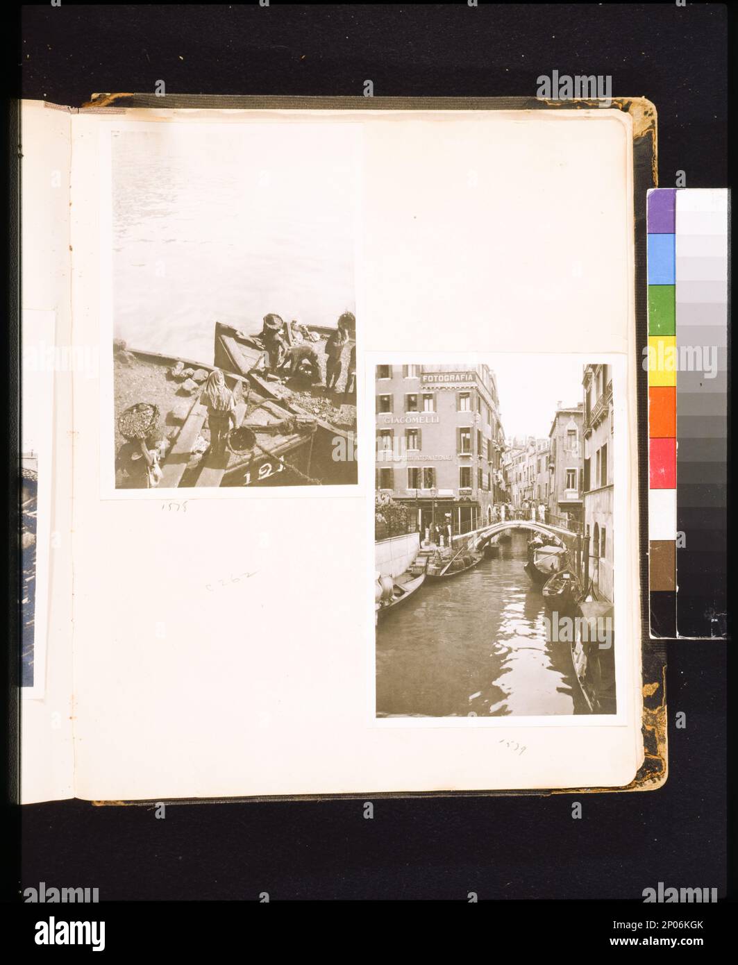 Men carrying coal in boats, Malta Bridge over a canal and buildings ...
