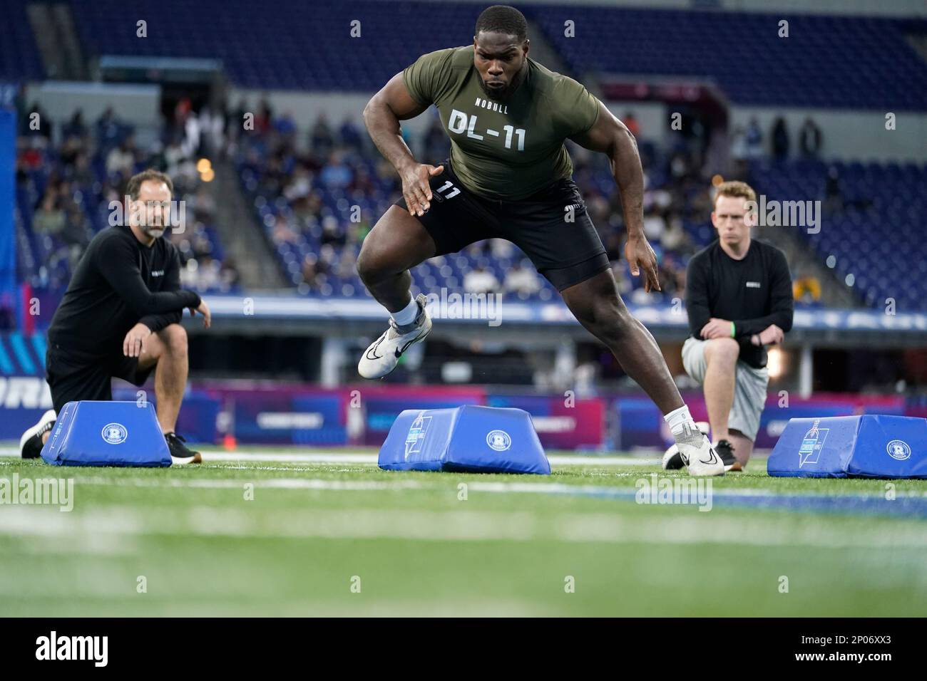 Texas defensive lineman Moro Ojomo runs a drill at the NFL football ...