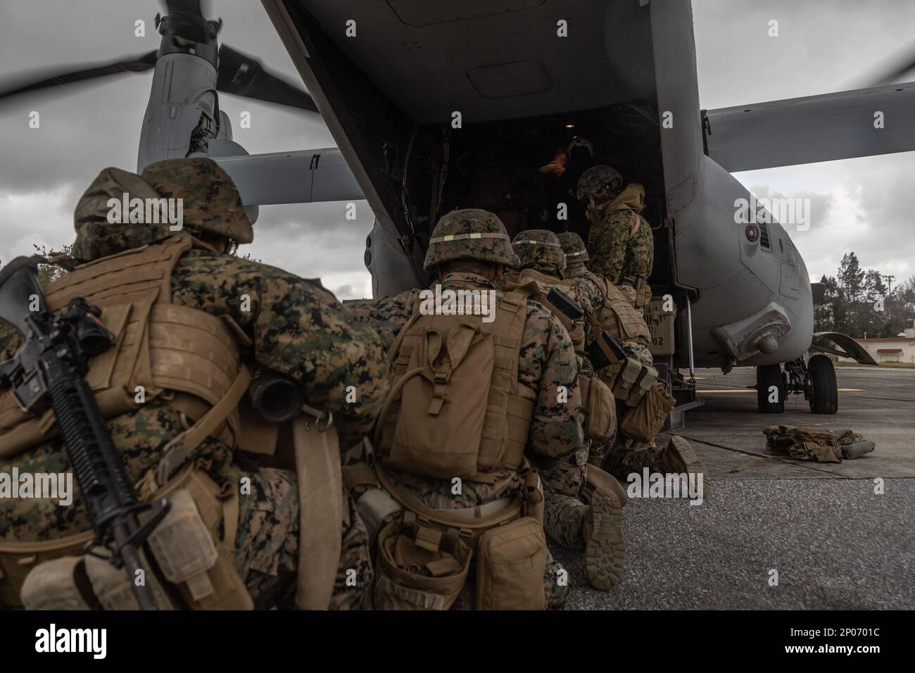 U.S. Marines with Combat Logistics Regiment 3 (CLR-3) prepare to board ...