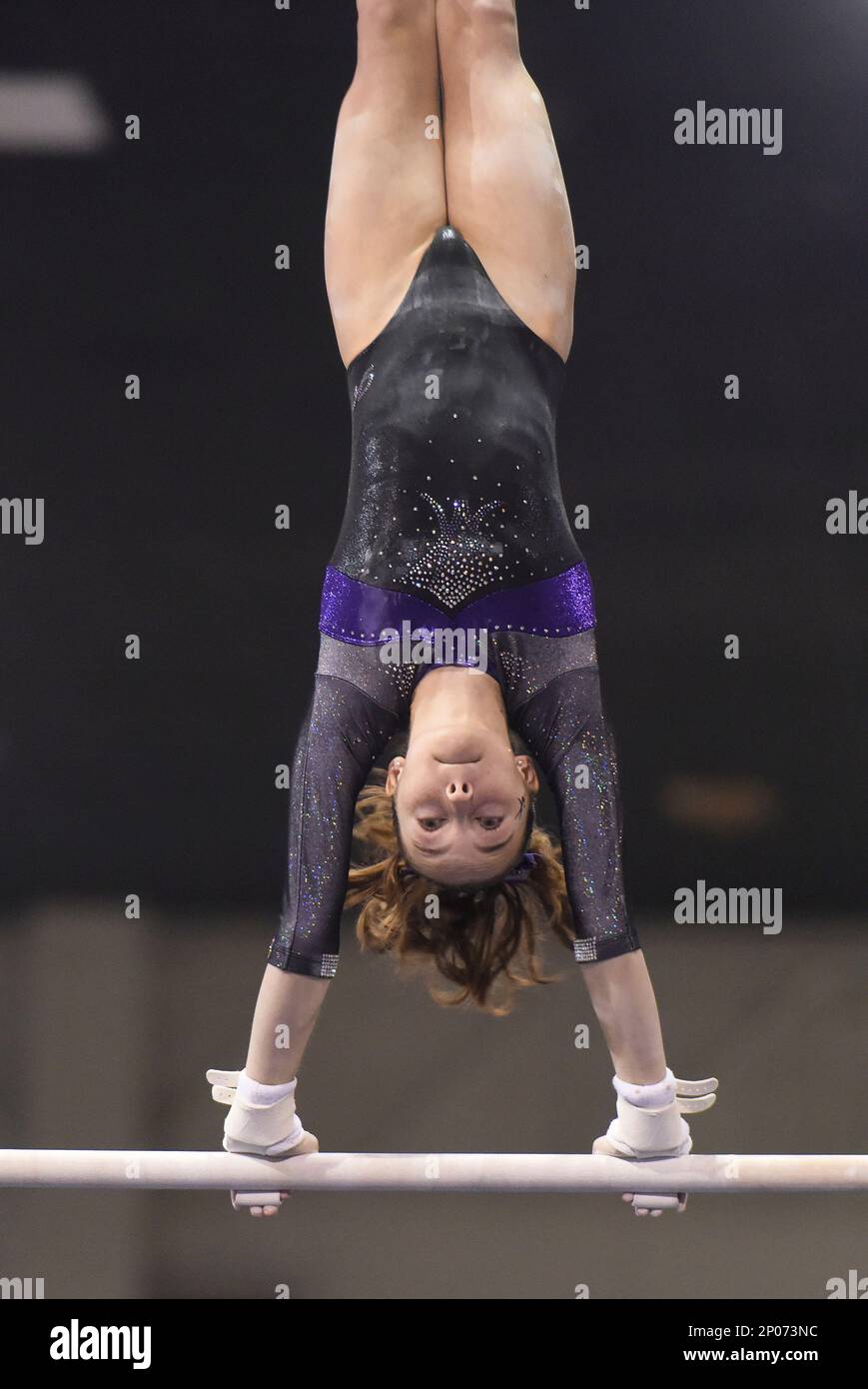 Morgan Streeter of Metroplex Gymnastics competes on the uneven bars ...