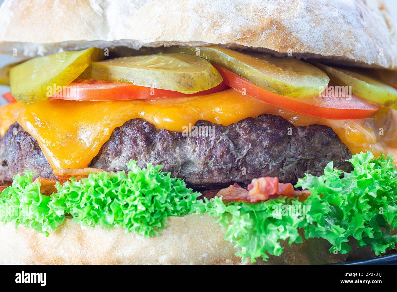 Homemade huge giant cheeseburger for burger party, made on bread ...