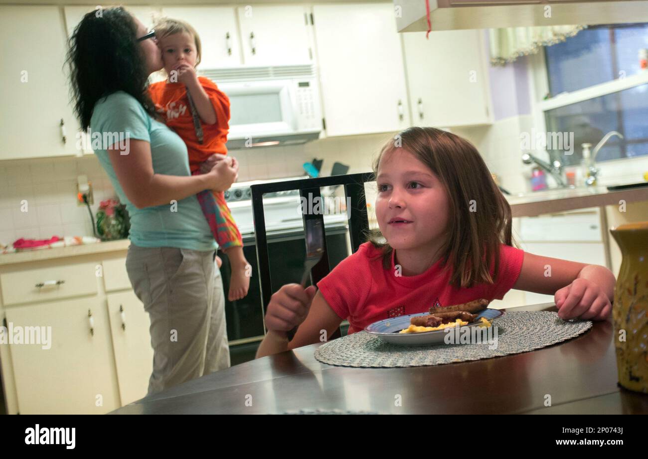 In this Aug. 15, 2016 photo, Jessica Piascik , 29, gets her daughter ...