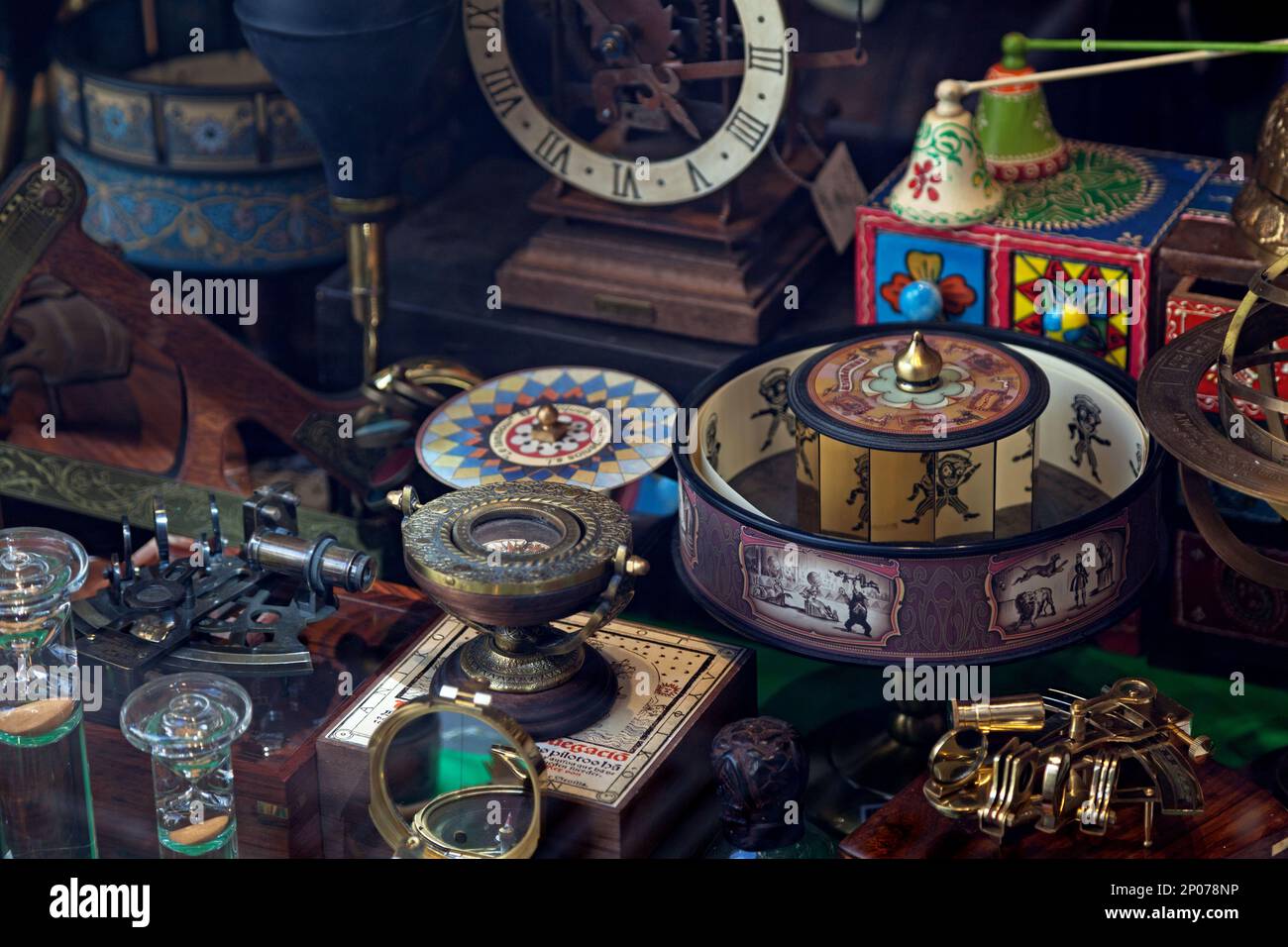 Close-up on nineteen century antiques behind the window of a shop in ...