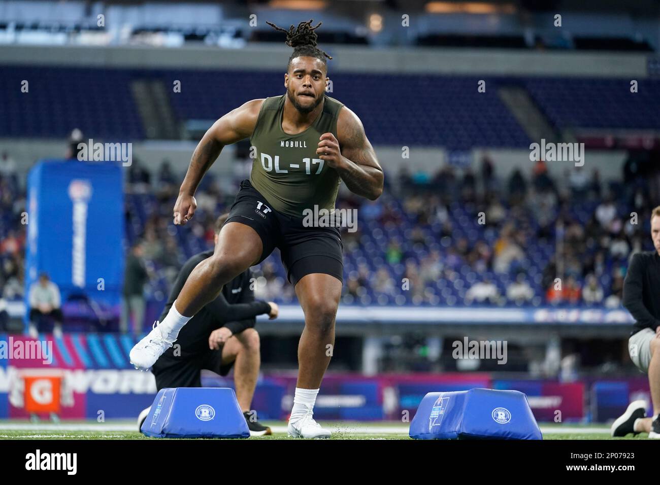 West Virginia defensive lineman Dante Stills runs a drill at the NFL ...
