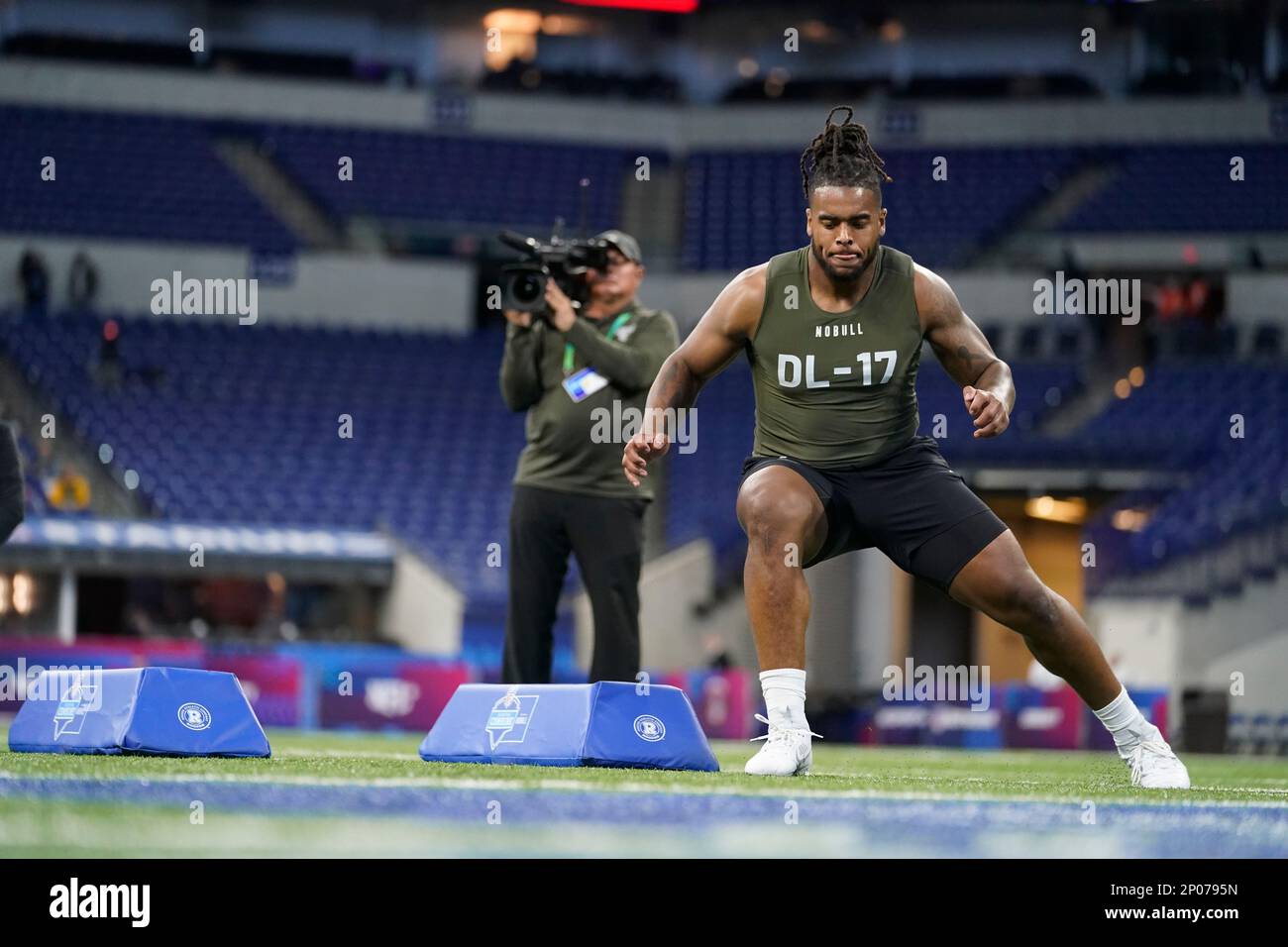 West Virginia defensive lineman Dante Stills runs a drill at the NFL ...