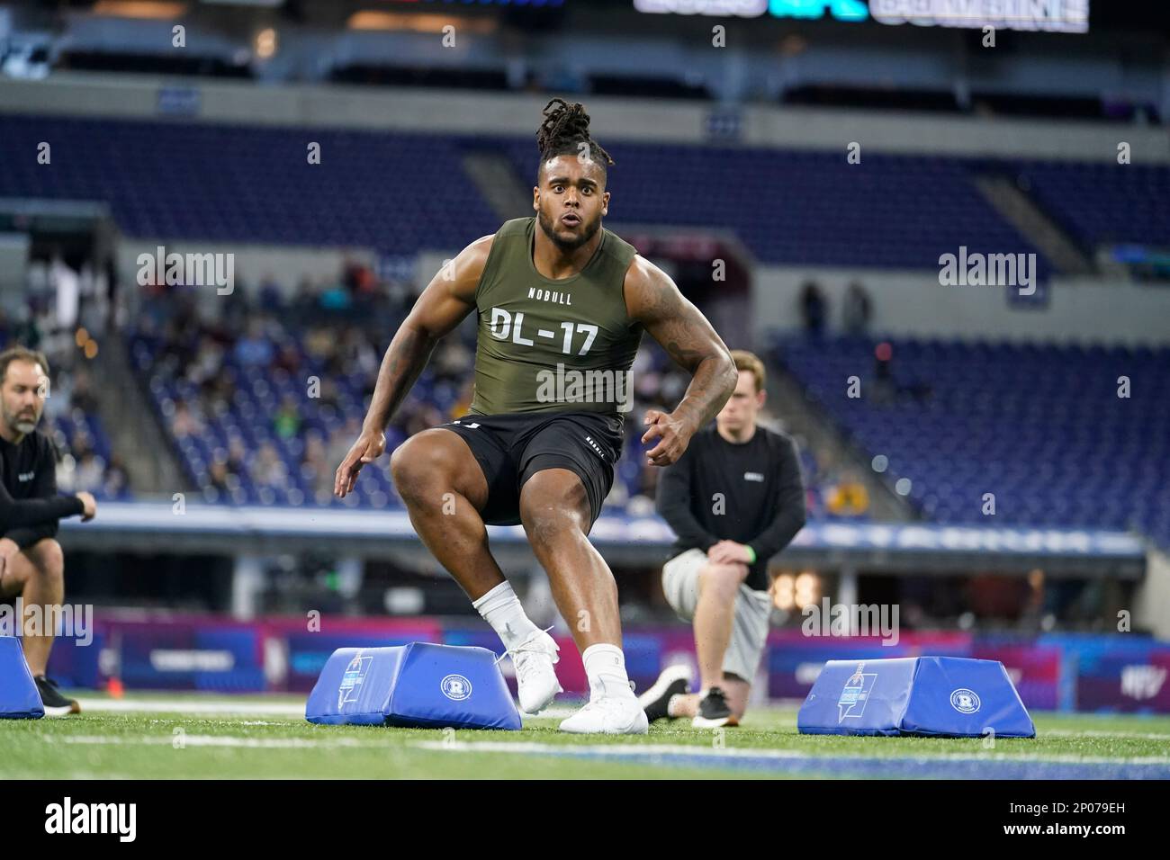 West Virginia defensive lineman Dante Stills runs a drill at the NFL ...