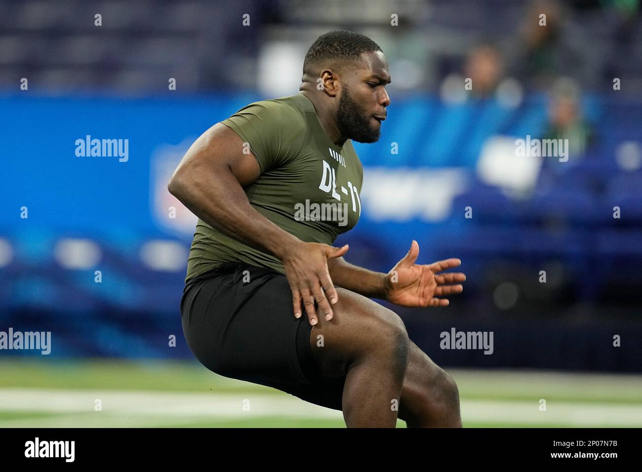 Texas defensive lineman Moro Ojomo runs a drill at the NFL football ...
