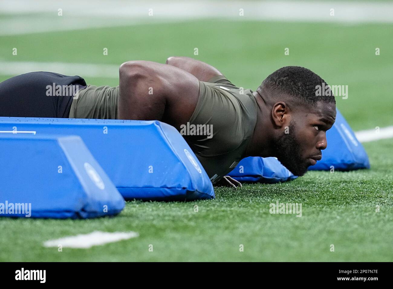 Texas defensive lineman Moro Ojomo runs a drill at the NFL football ...