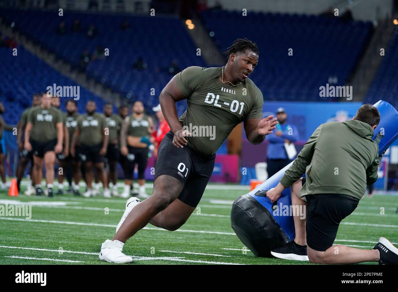 Wisconsin defensive lineman Keeanu Benton runs a drill at the NFL ...