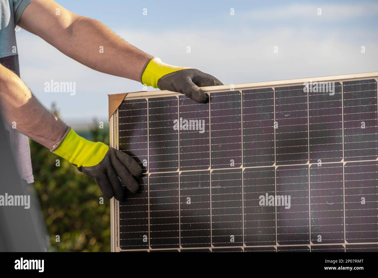 Solar panel in the hands of a worker .Fitting and installation of solar ...