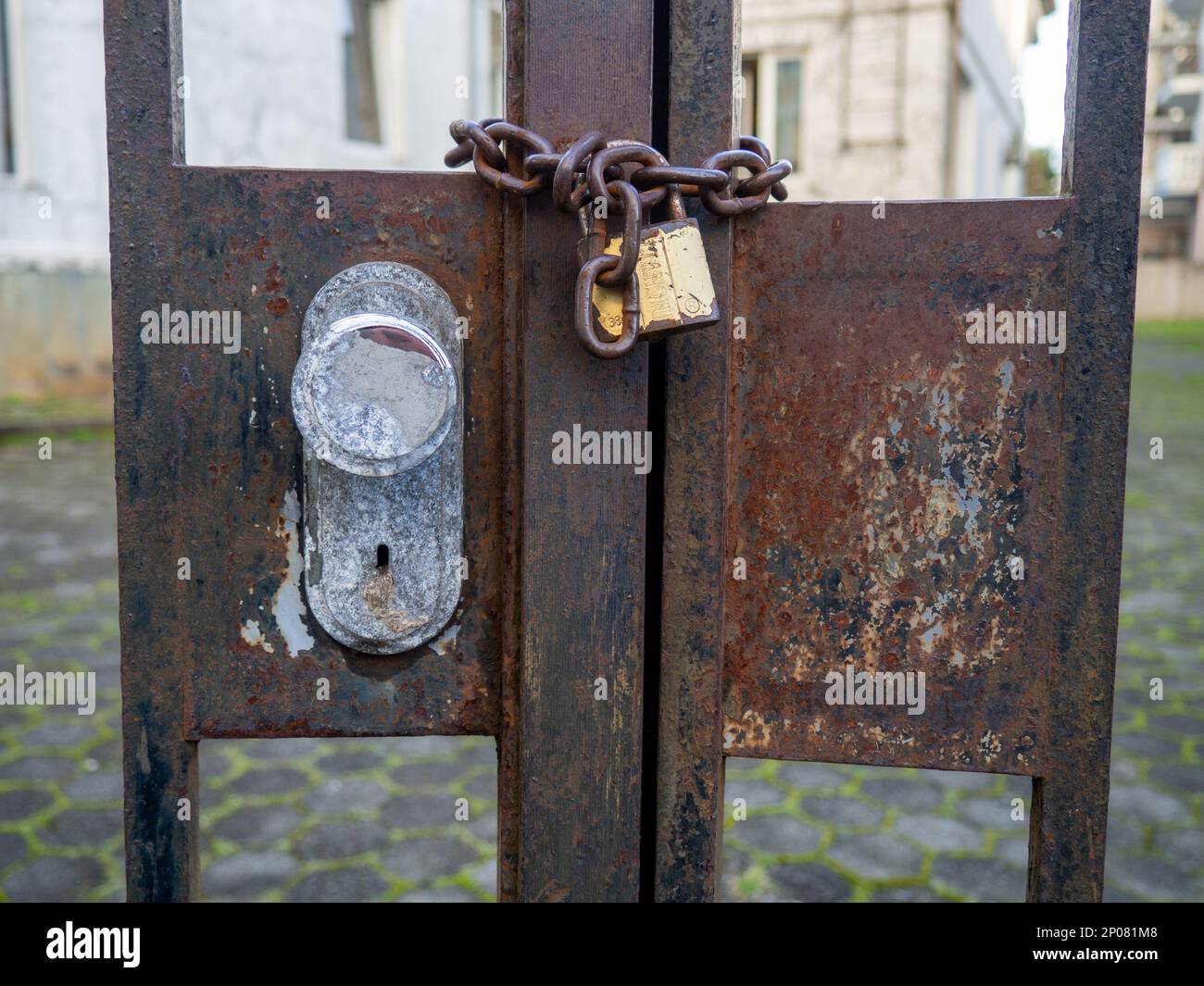 Gate lock. Padlock in action. Rusty chains and gates. No entry. Closed ...