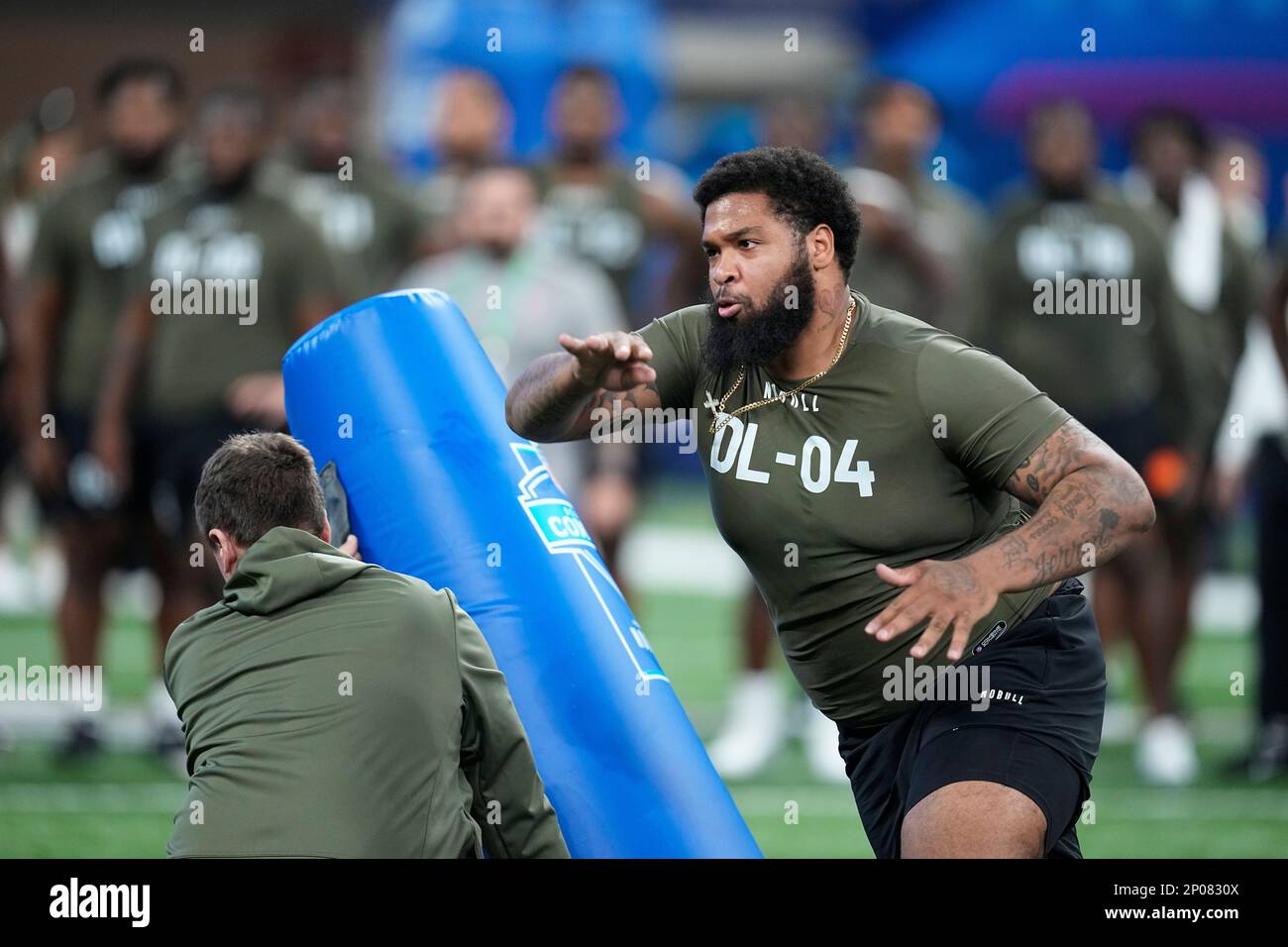 Coastal Carolina defensive lineman Jerrod Clark runs a drill at the NFL ...