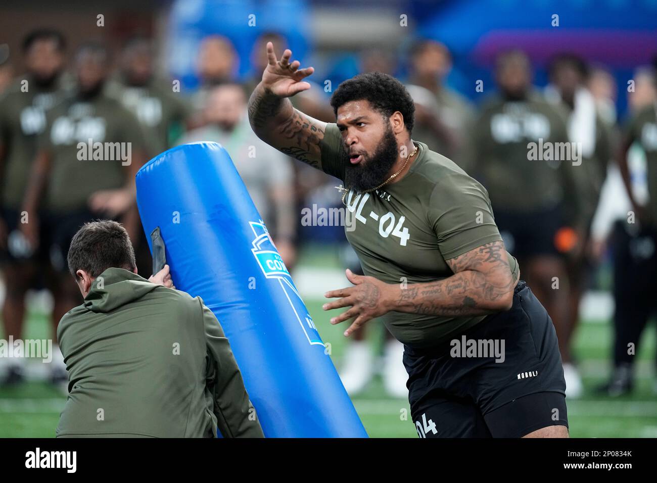 Coastal Carolina defensive lineman Jerrod Clark runs a drill at the NFL ...