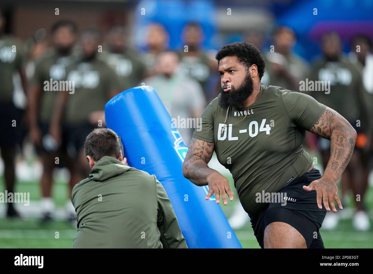 Coastal Carolina defensive lineman Jerrod Clark runs a drill at the NFL ...