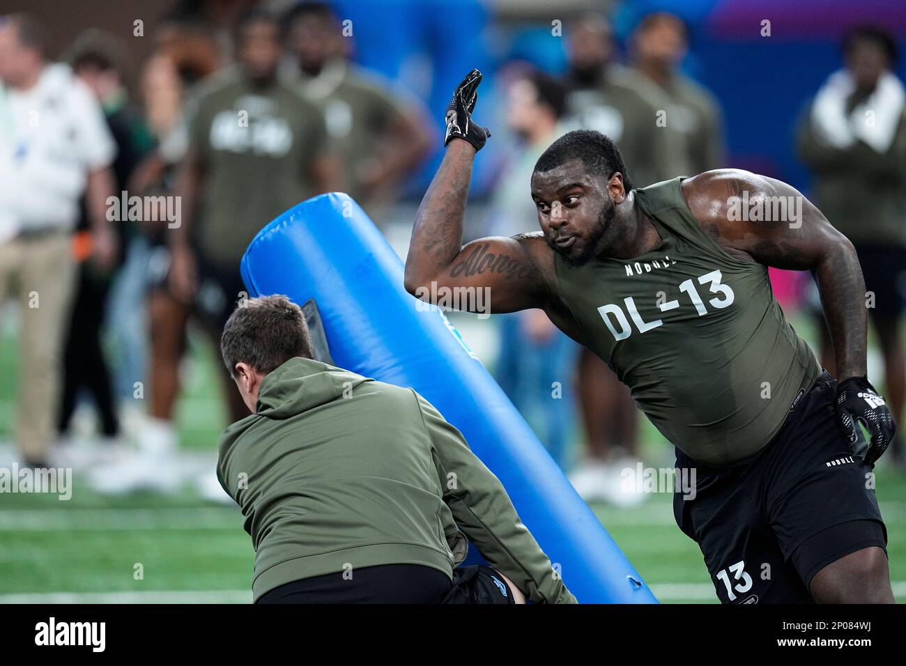 Oklahoma defensive lineman Jalen Redmond runs a drill at the NFL ...