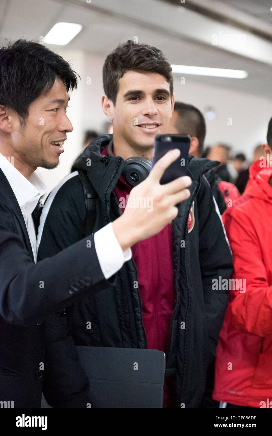 Brazilian football player Oscar of Shanghai SIPG F.C., right, takes ...