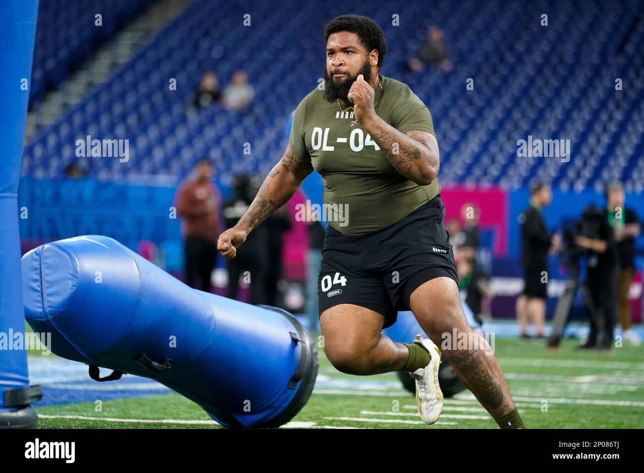 Coastal Carolina defensive lineman Jerrod Clark runs a drill at the NFL ...