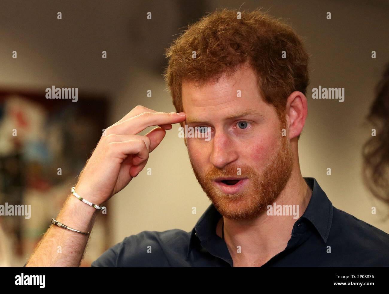 Britain's Prince Harry gestures, during a visit to the 'Heads Together ...