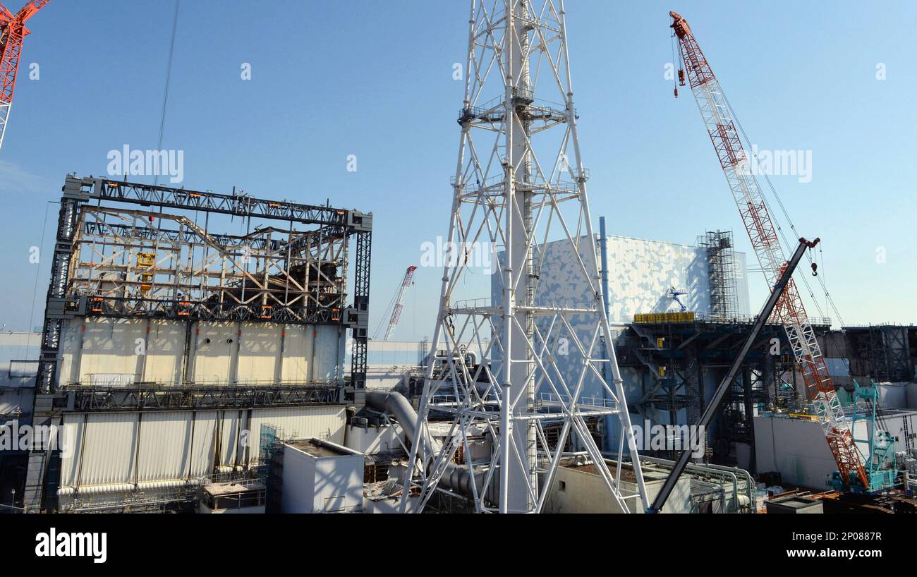 This photo shows the Unit 2 (R) and Unit 1 reactors of the Fukushima No ...