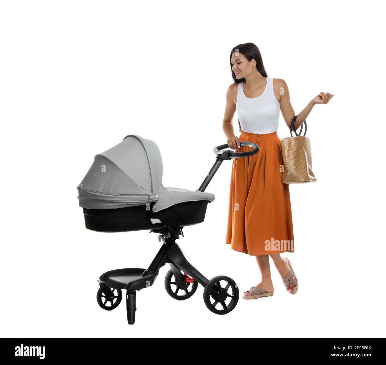 Happy young woman with baby stroller on white background Stock Photo ...