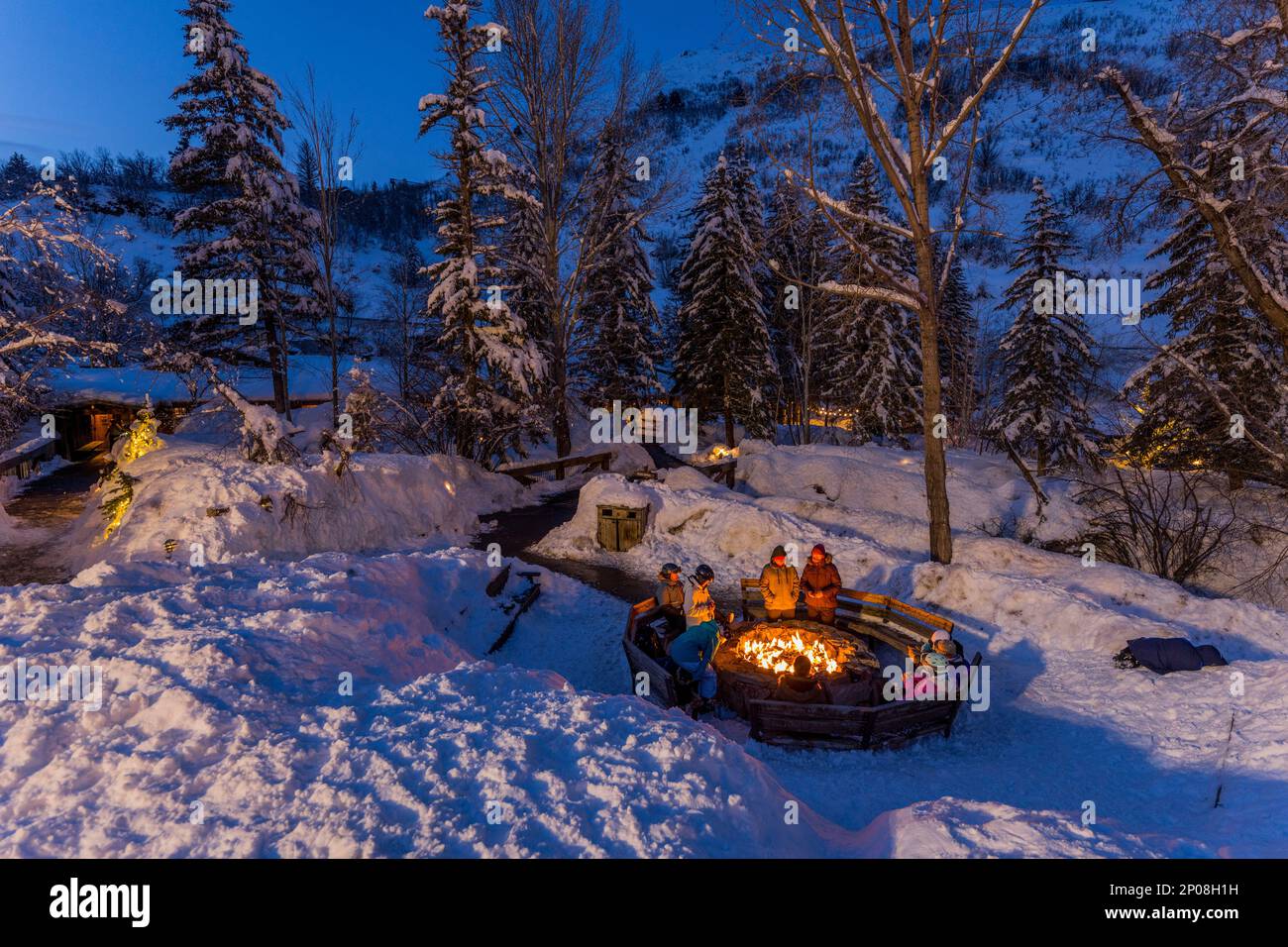 People at night warming up at a gas fire pit at Sundance Resort, also ...
