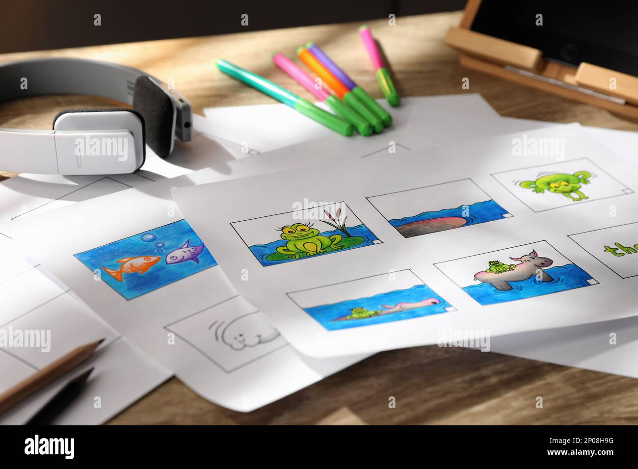 Storyboards with cartoon sketches at workplace. Pre-production process ...