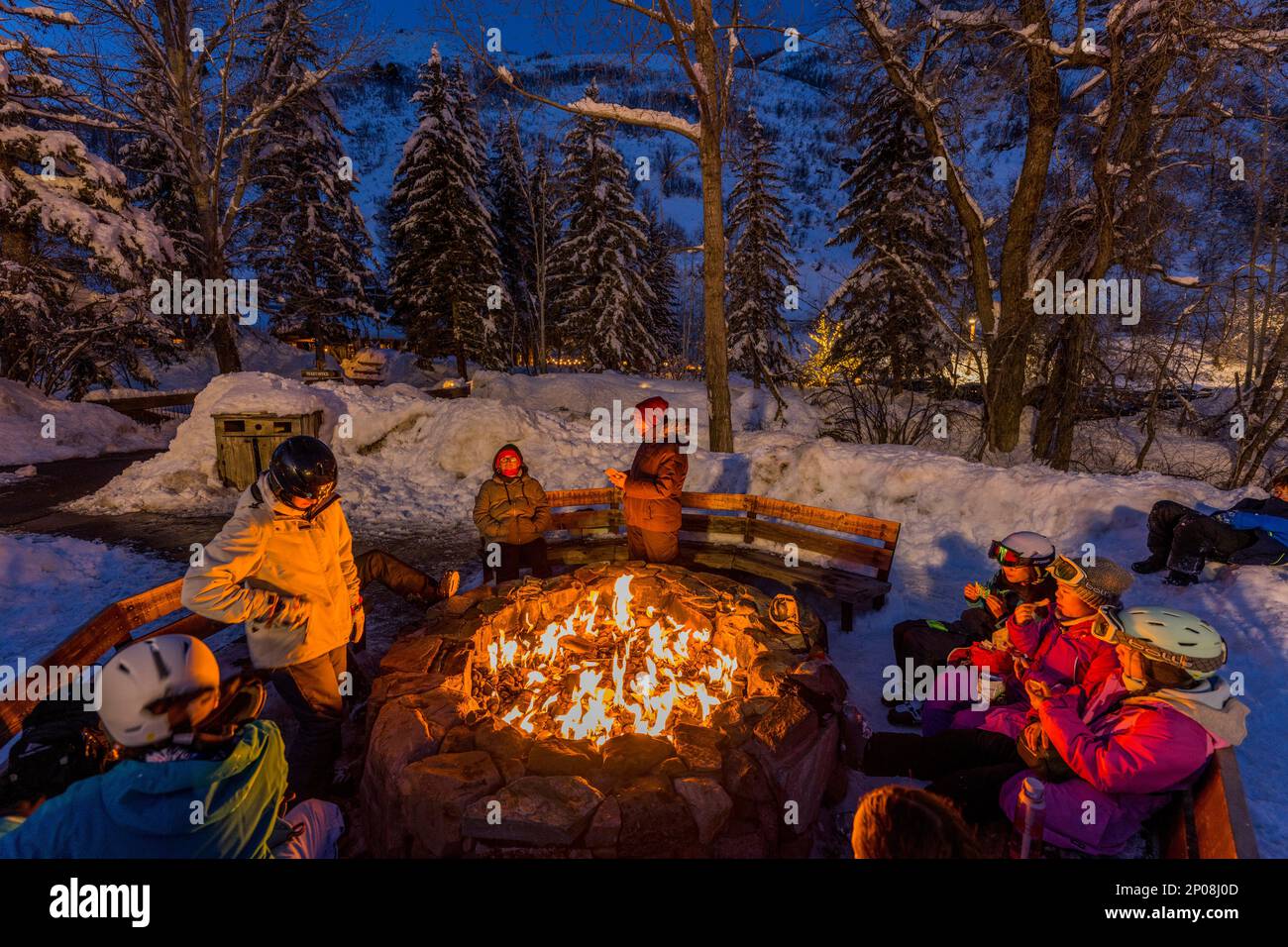 People at night warming up at a gas fire pit at Sundance Resort, also ...