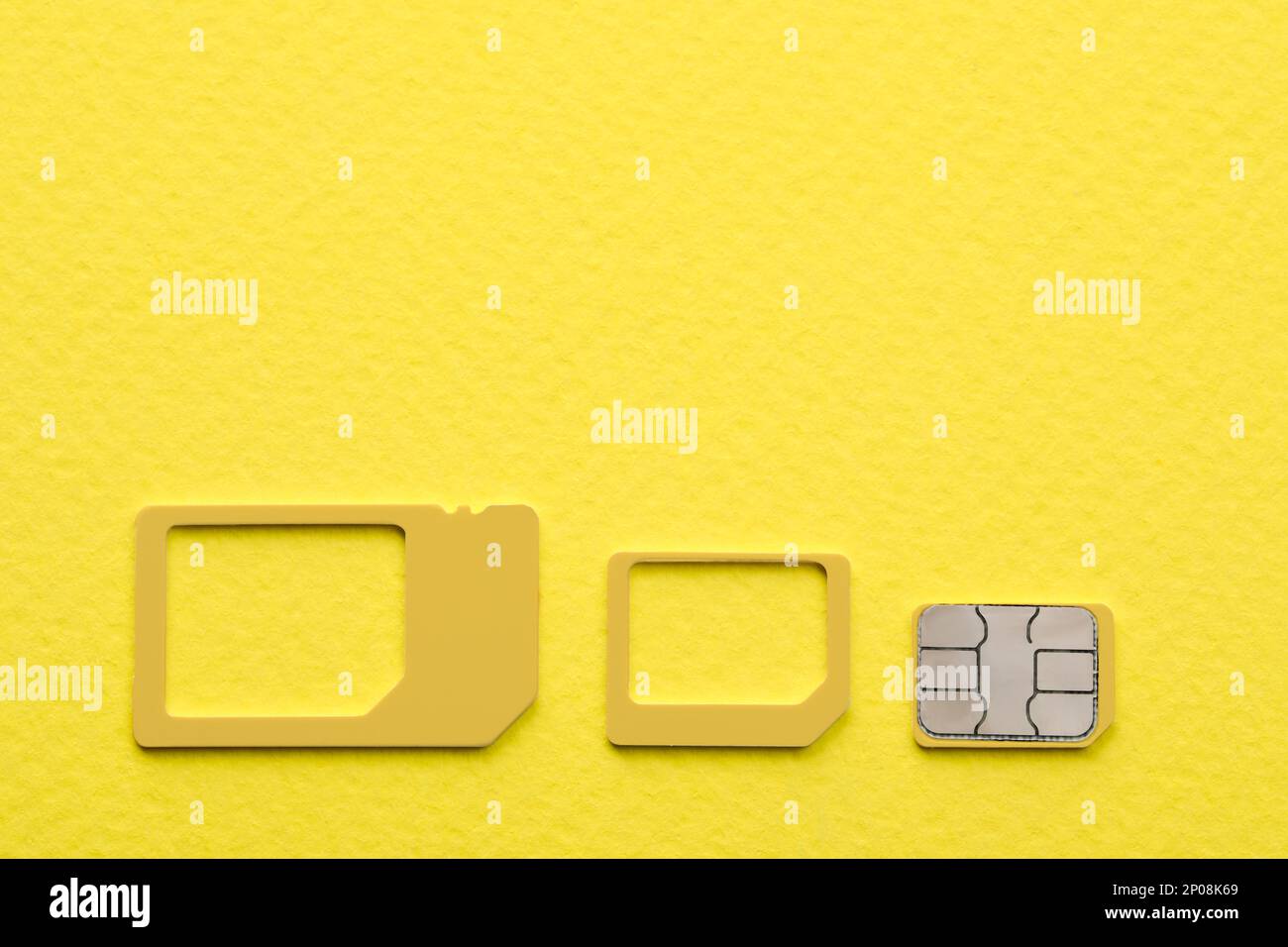 Multi SIM card on yellow background, flat lay. Space for text Stock ...