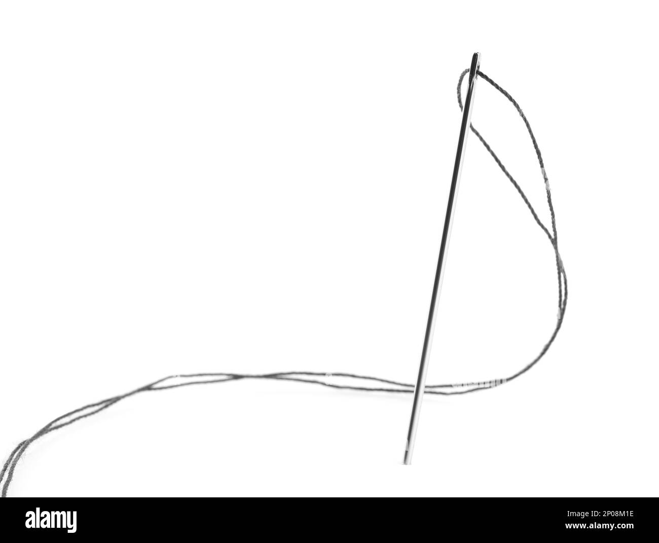 Sewing needle with thread on white background Stock Photo - Alamy