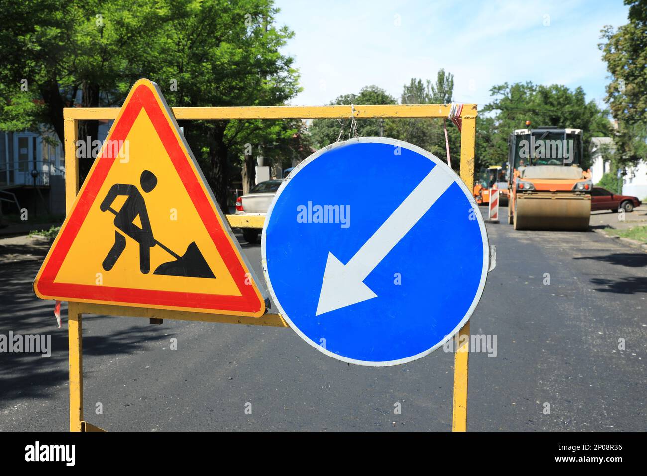 Barricade with traffic signs on city street. Road repair Stock Photo ...
