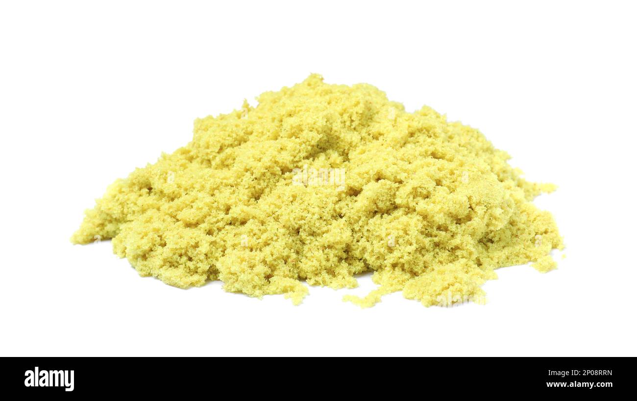 Pile of yellow kinetic sand on white background Stock Photo - Alamy