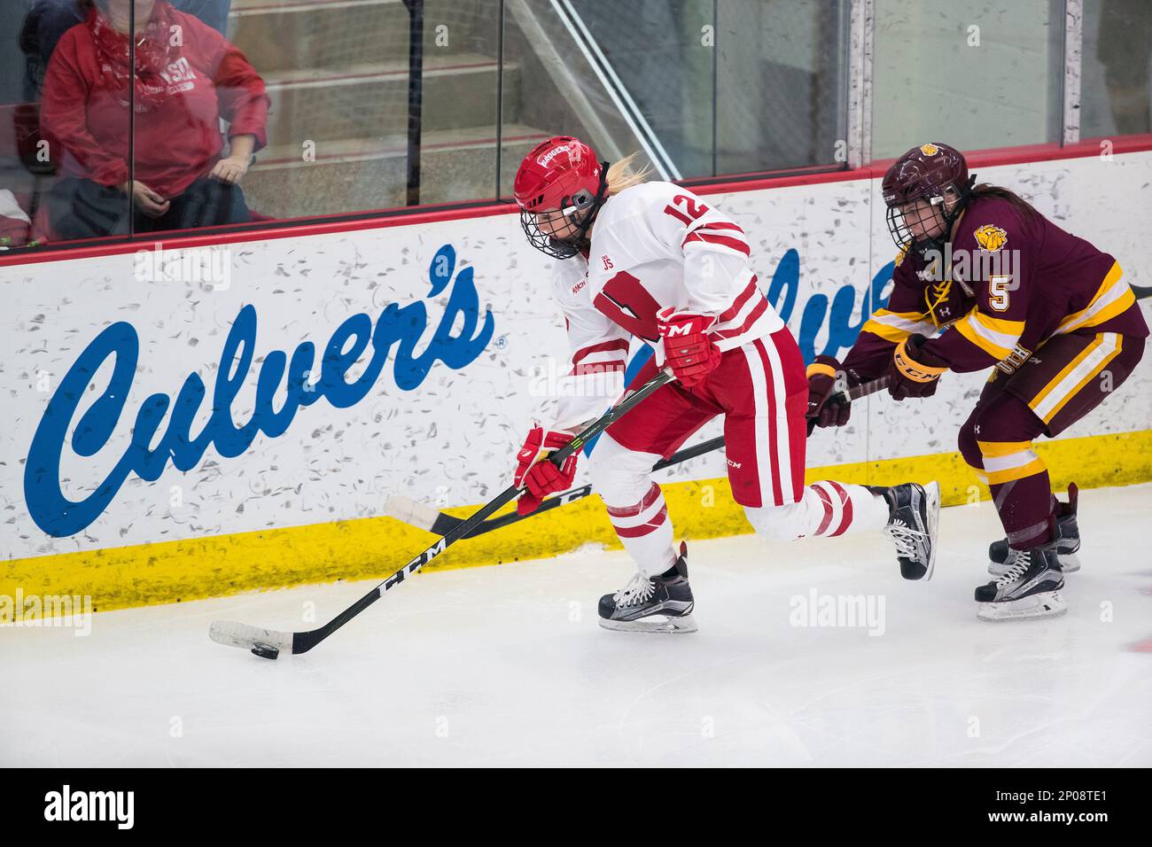 Wisconsin Badgers Sophia Shaver (12) handles the puck during an NCAA ...