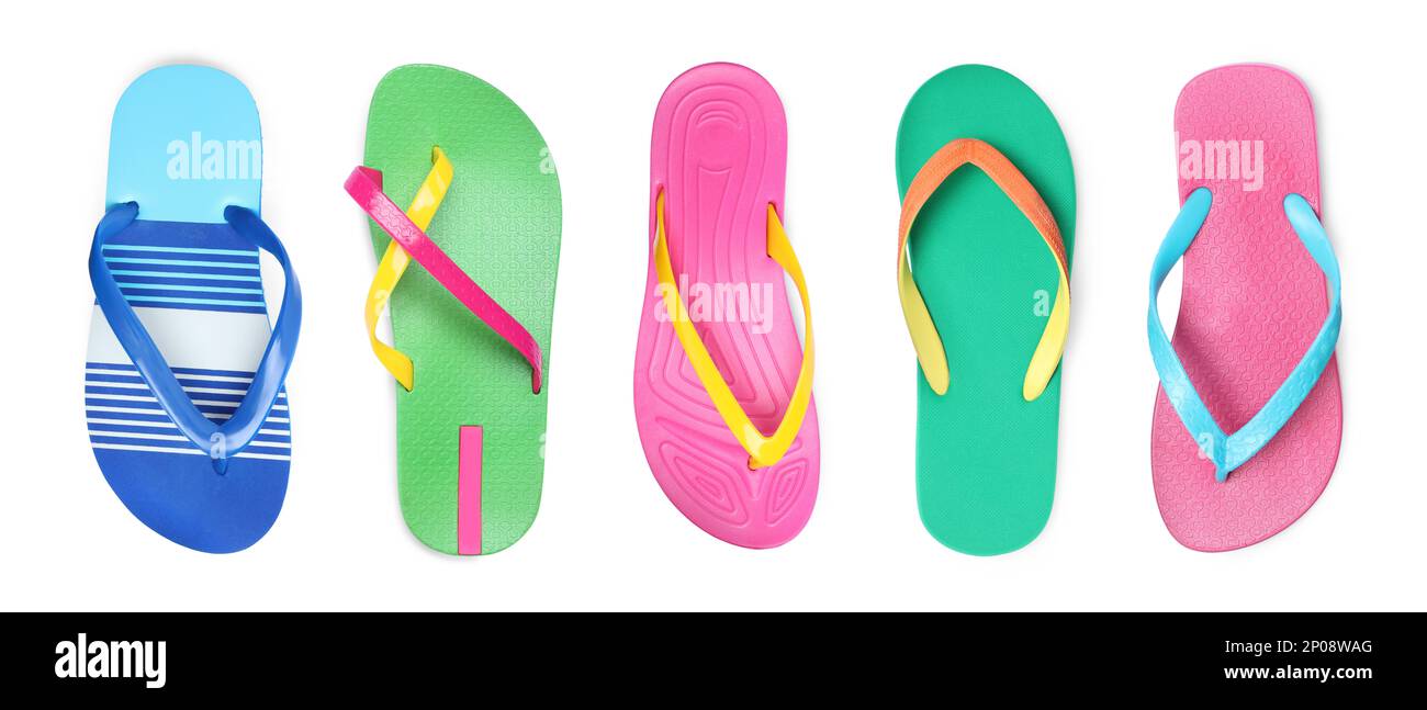 Set with different flip flops on white background, top view. Banner ...
