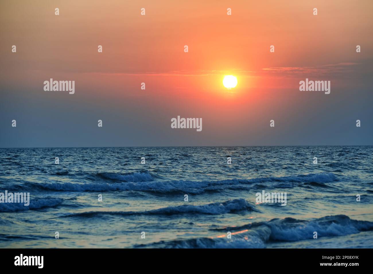 Sunrise over clam sea hi-res stock photography and images - Alamy