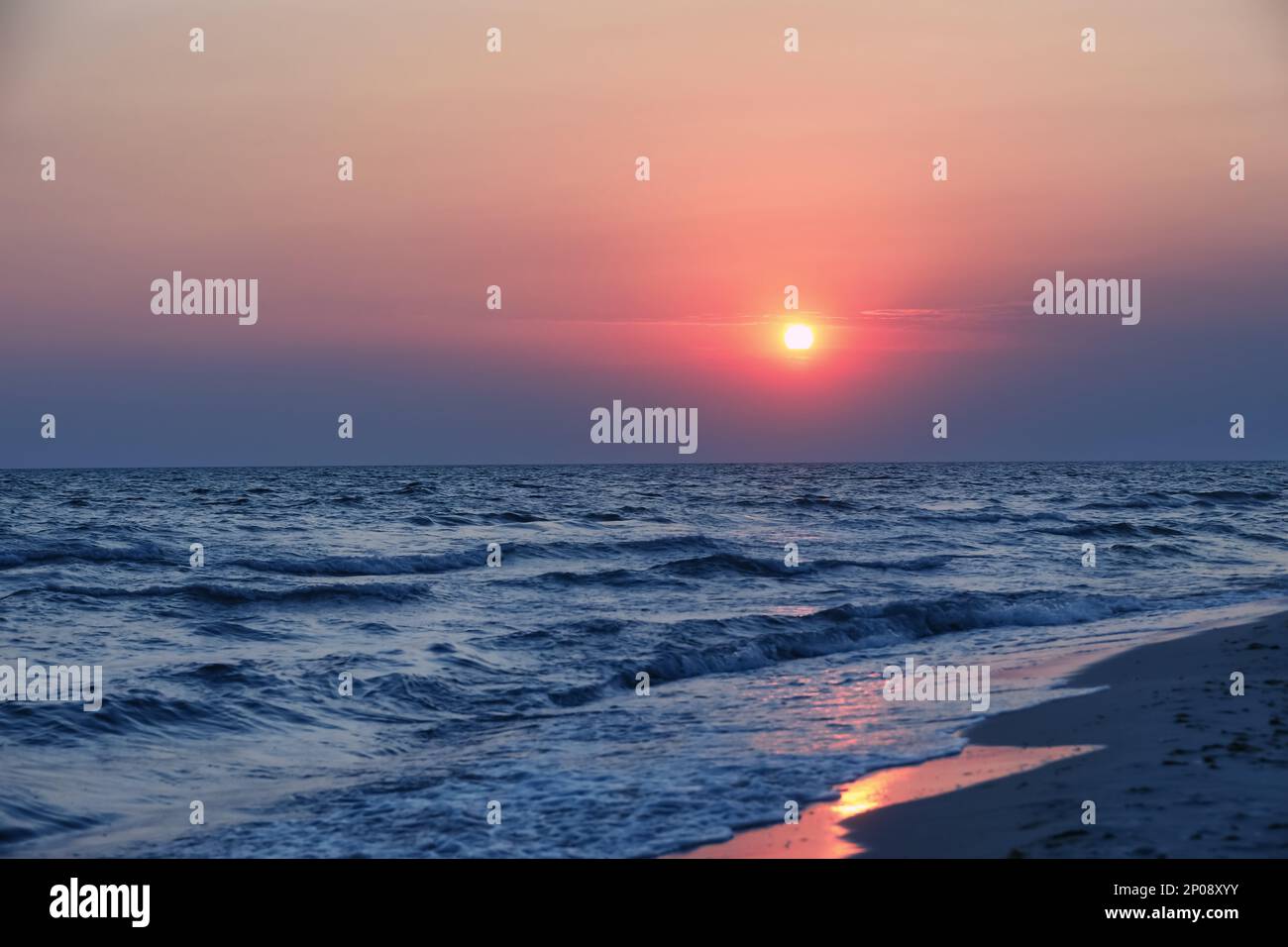 Sunrise over clam sea hi-res stock photography and images - Alamy