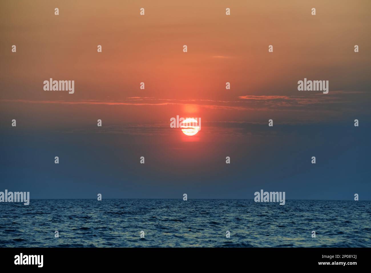 Sunrise over clam sea hi-res stock photography and images - Alamy