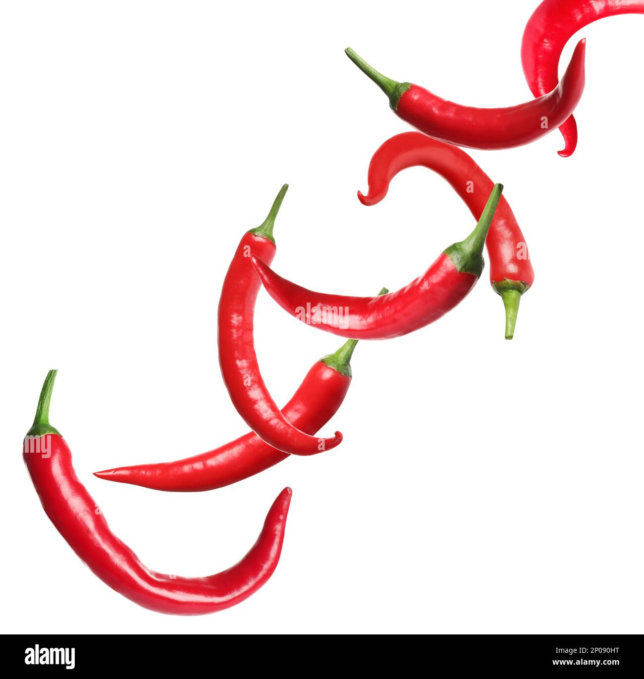 Ripe red chili peppers flying on white background Stock Photo - Alamy