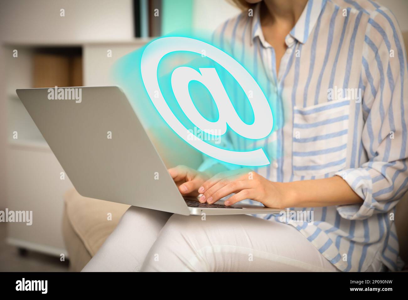 At sign illustration and woman sending email via laptop indoors ...