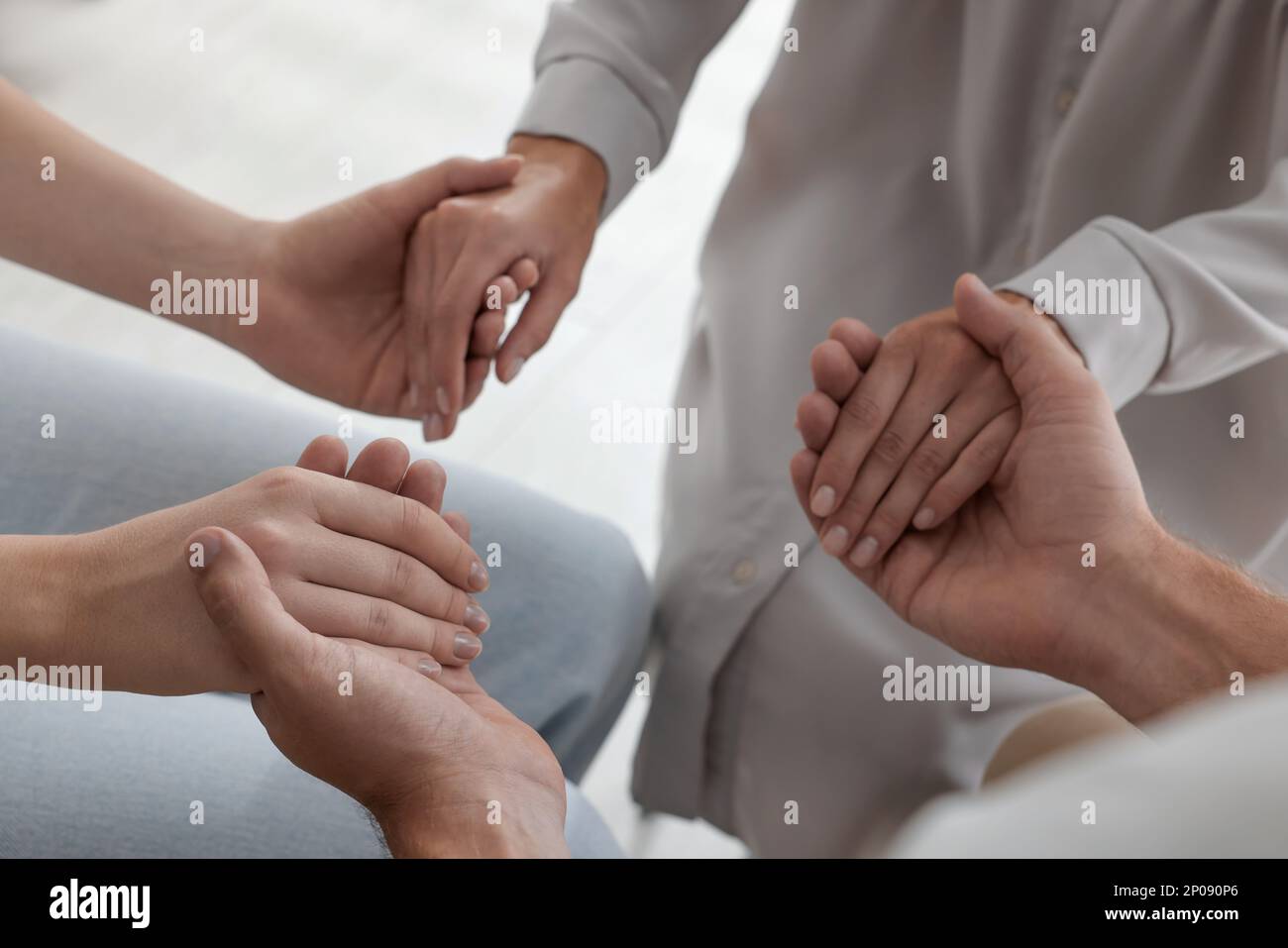 Group people praying holding hi-res stock photography and images - Alamy