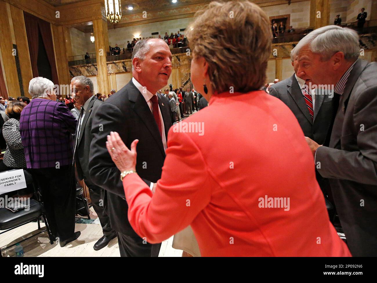 Louisiana Gov. John Bel Edwards greets state Sen. Sharon Hewitt at the ...