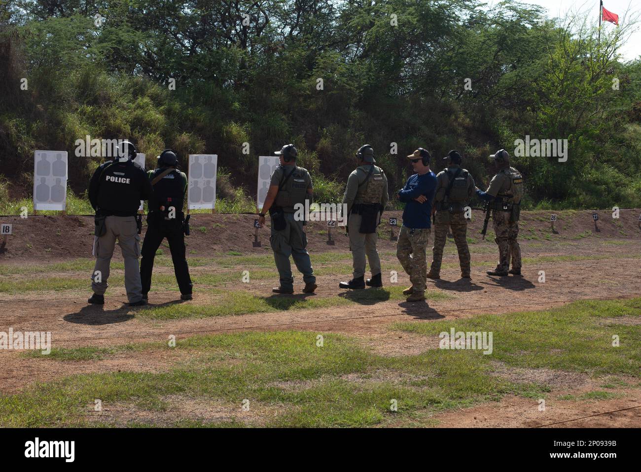 Officers with the Honolulu Police Department fire the M4 service ...