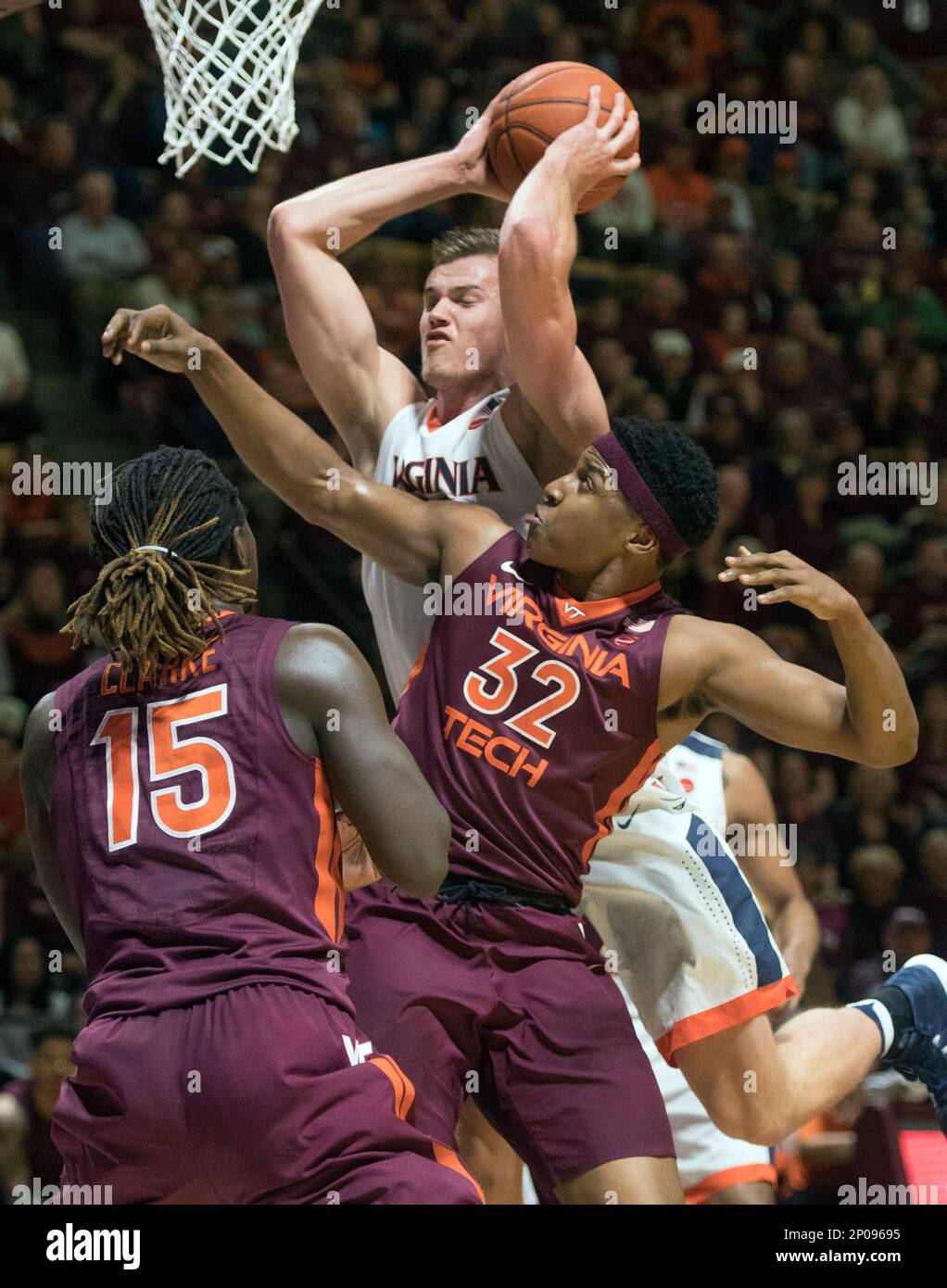 Virginia center Jack Salt, top, grabs a rebound against Virginia Tech ...