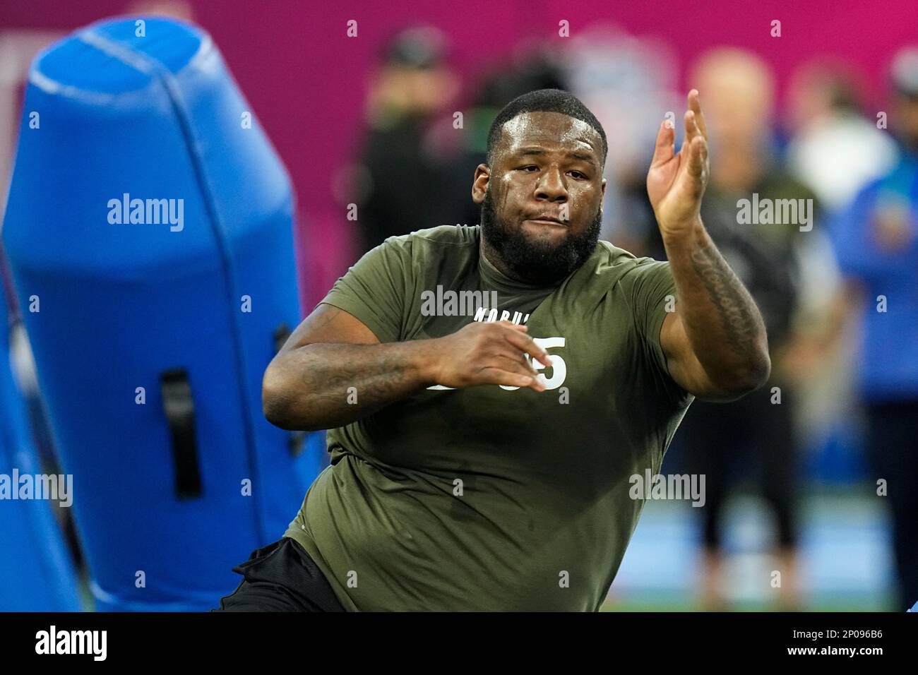 Texas defensive lineman Keondre Coburn runs a drill at the NFL football ...