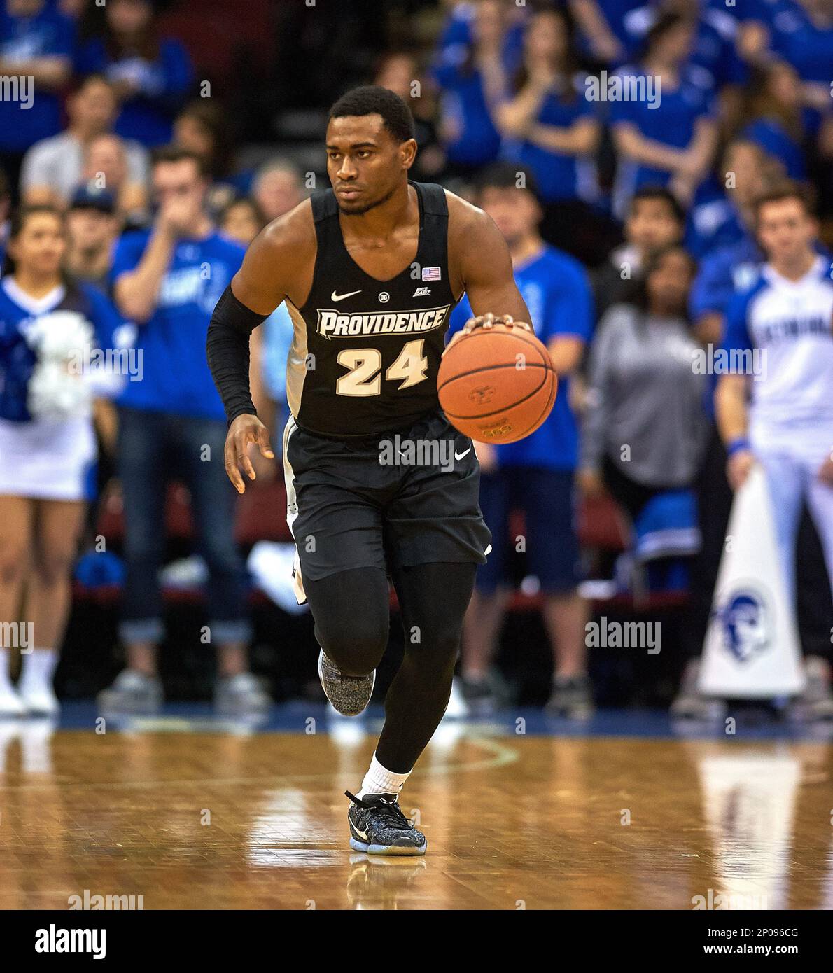 Providence guard Kyron Cartwright (24) brings the ball up court during ...