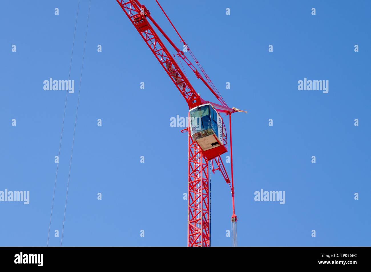 Tower crane and control cab on construction site Stock Photo - Alamy