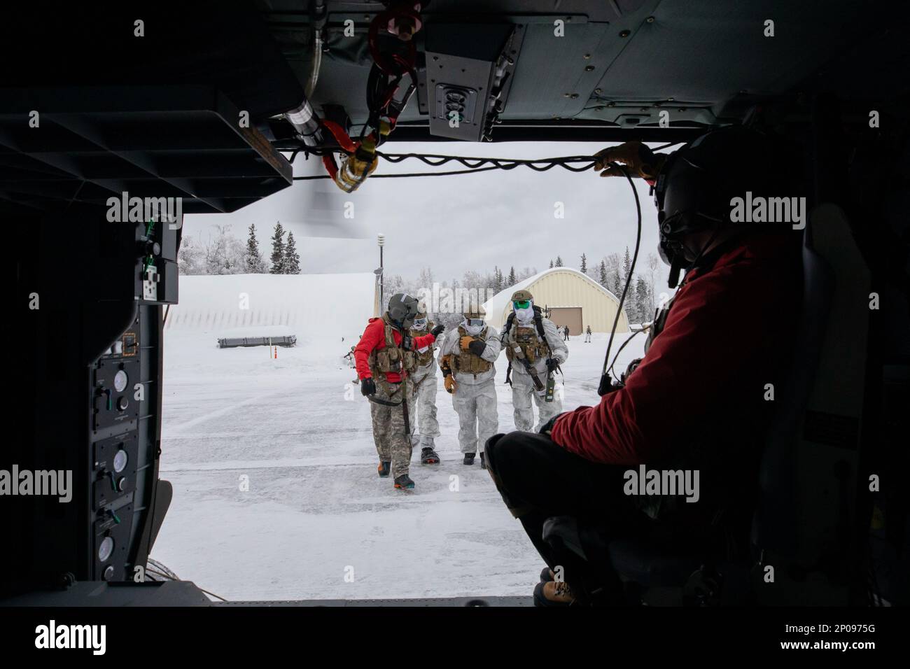 Alaska Army Guard Spc. Matthew Tucker, left, a flight medic, and Staff ...