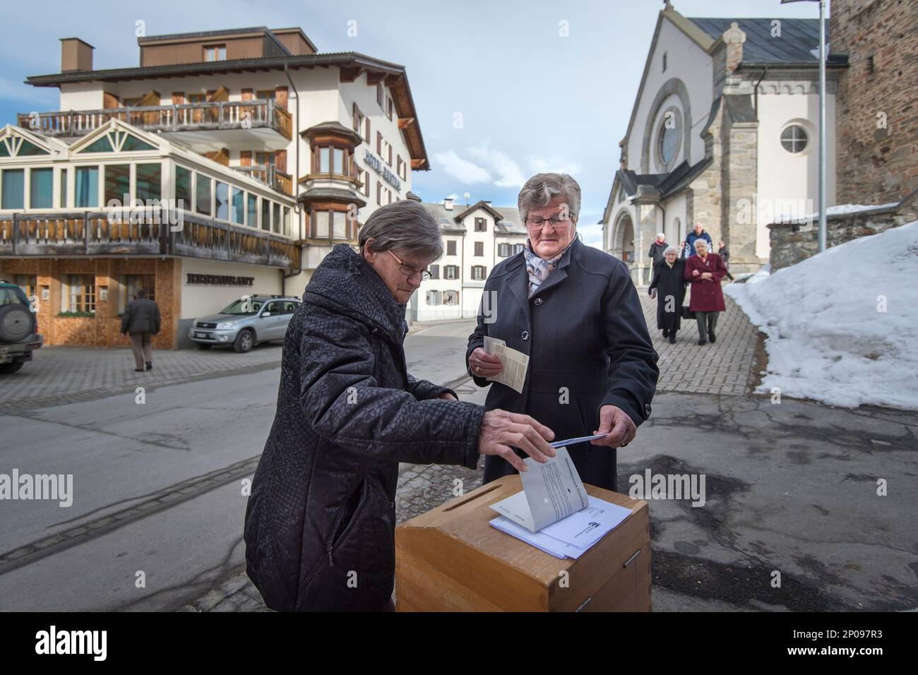 Swiss voters cast their ballot in Obersaxen, Switzerland, Sunday Feb ...