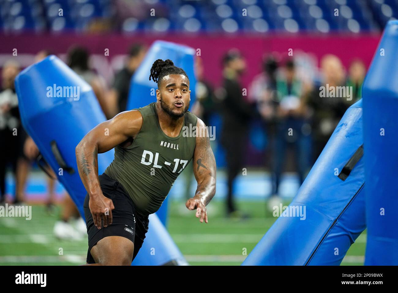 West Virginia defensive lineman Dante Stills runs a drill at the NFL ...